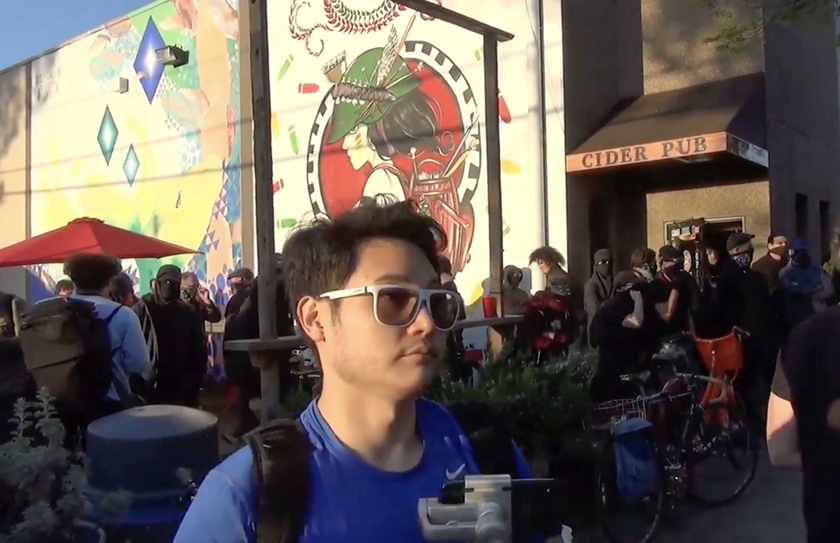 Shared post - Photo: Andy Ngo stands outside an Antifa pub while ...